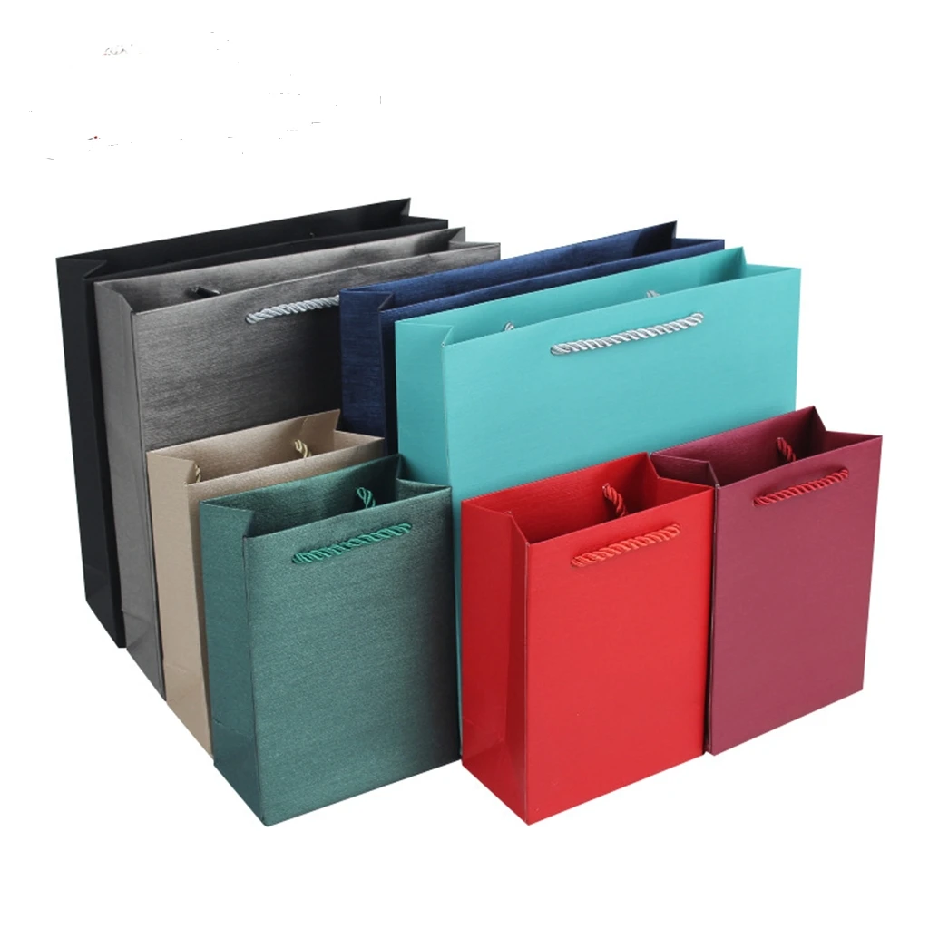 Custom-paper-bag-gold-hot-stamping-with-gold-ribbon-handle-Golden-edge ...