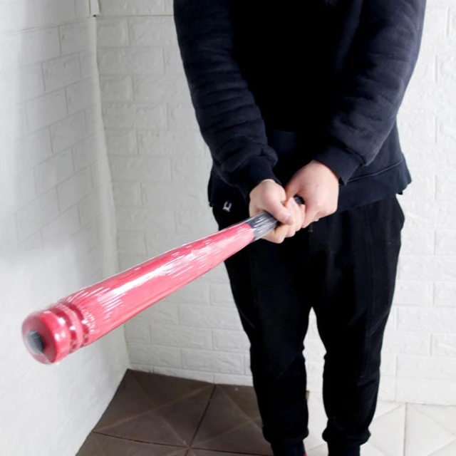 Hand Holding Softball Bat
