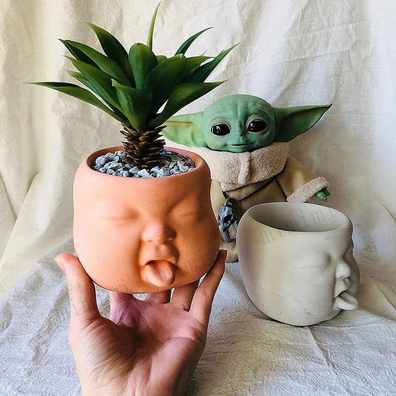 Baby In Flower Pot