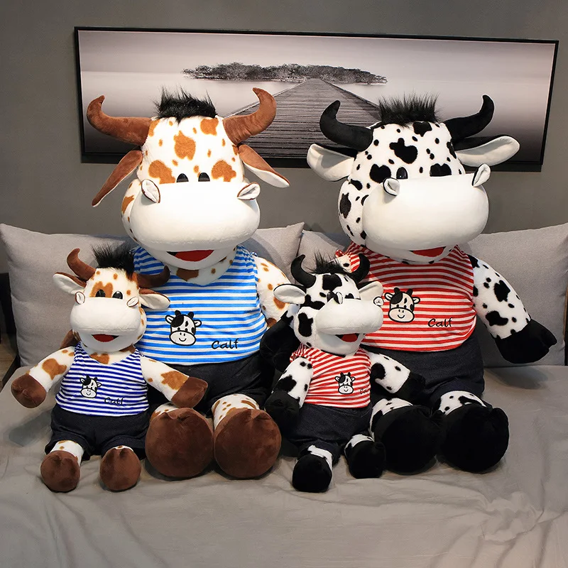 Cartoon cow plush toy filled with striped animal red and blue T shirt ...