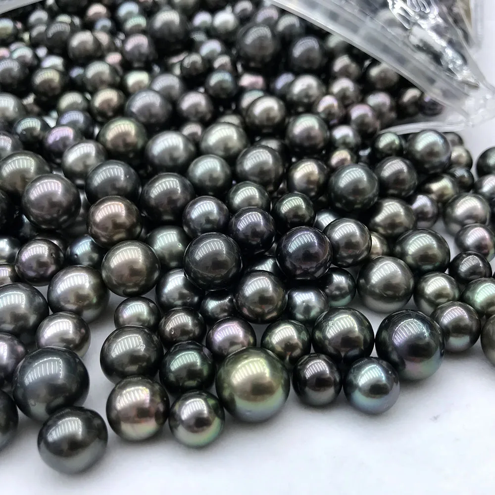 Perles-de-perles-de-mer-de-Tahiti-noires-naturelles-perle-ronde-AA ...