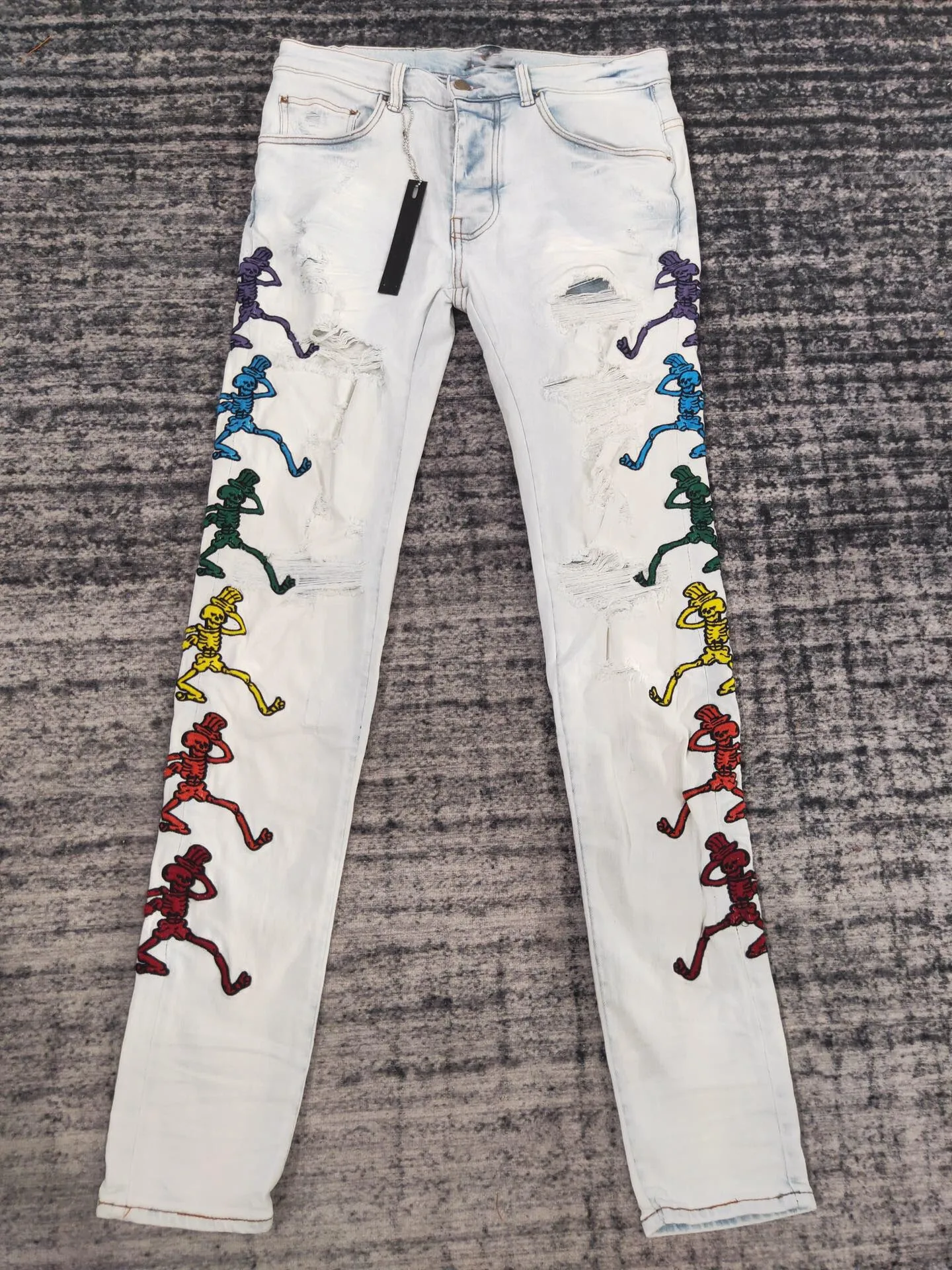 Discounted-men-side-embroidery-skeleton-distressed-jeans.jpg