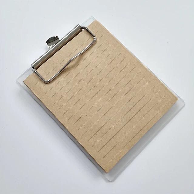 Clipboard With Yellow Paper