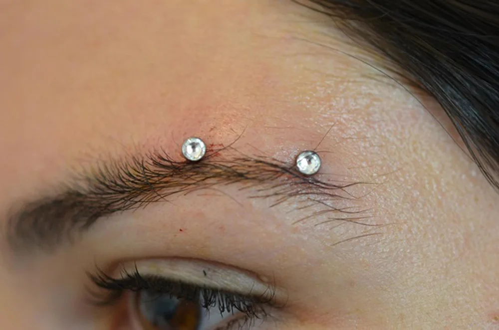 Horizontal Eyebrow Piercing