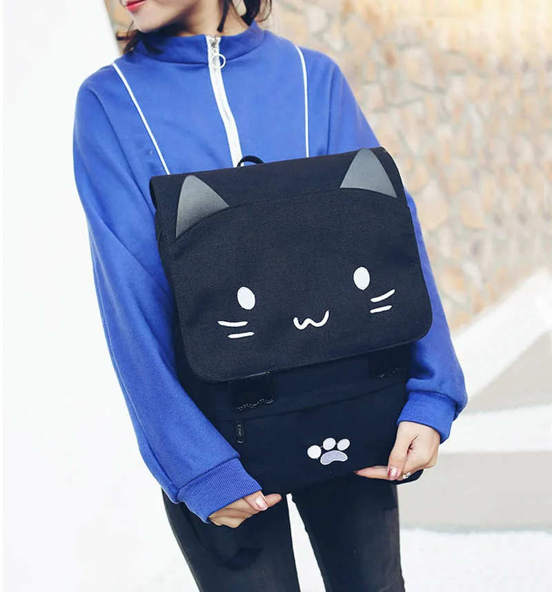 Musta värvi seljakott kassi näoga - Koolikotid