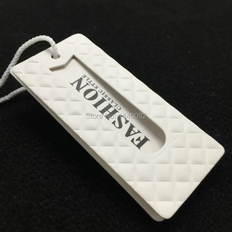 Customized top quality clothing embossed tags/garment shape cutting ...