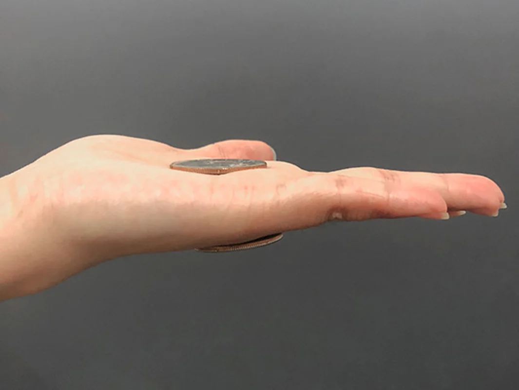 Coin Over Knuckles Trick