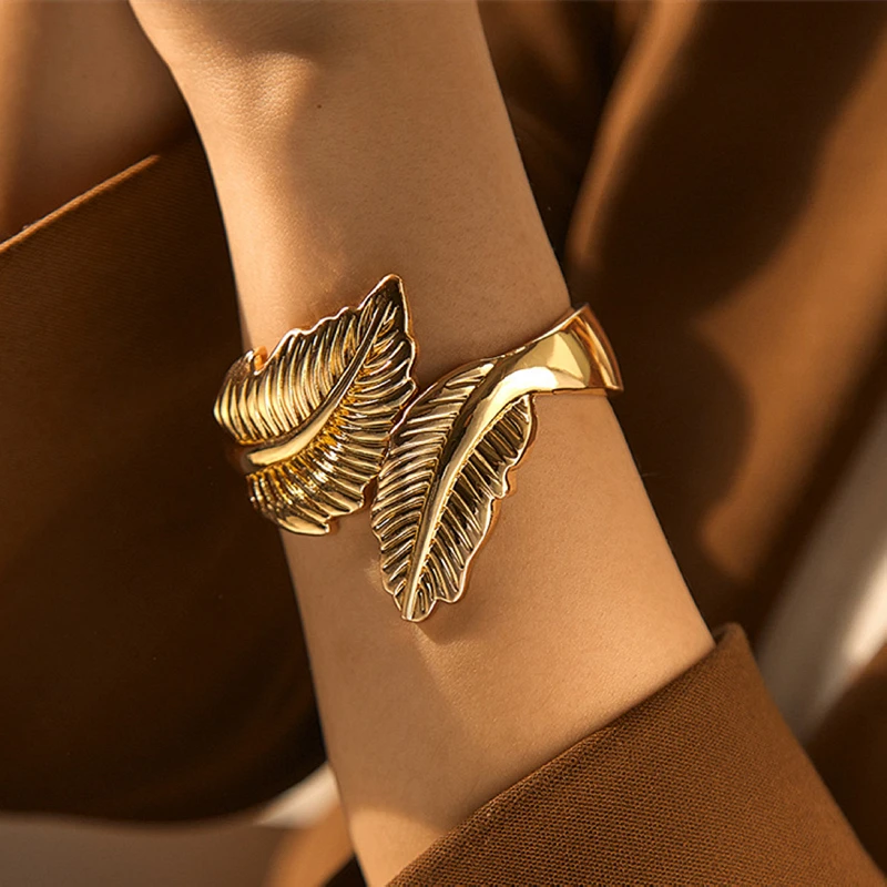 Elegant-Charm-Leaf-Shaped-Open-Bangles-for-Women-New-Trend-Gold-Plated-Big-Leaves-Cuff-Bracelets.jpg