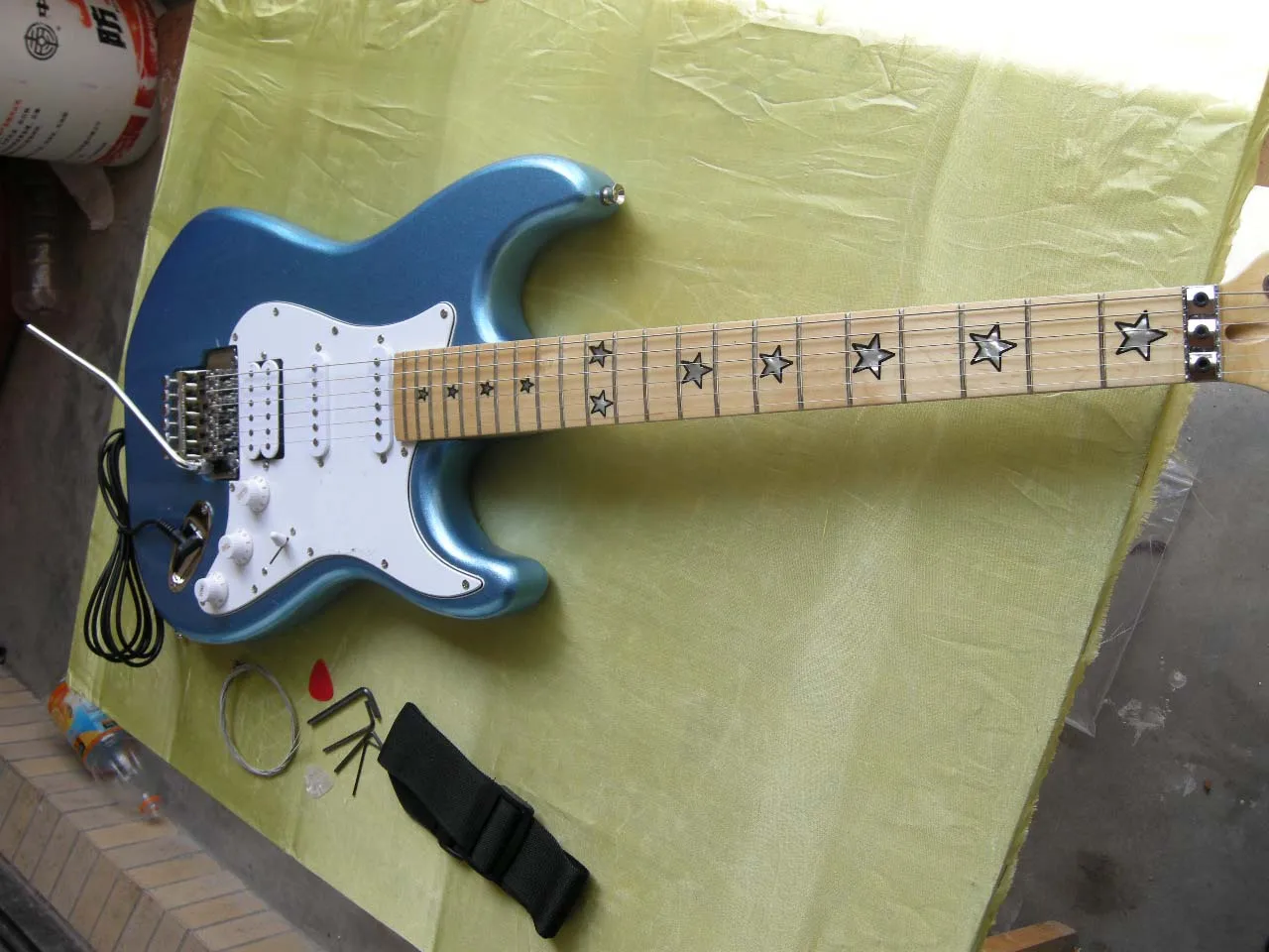 Metallic-blue-electric-guitar-with-star-shaped-inlaid-maple-fingerboard ...