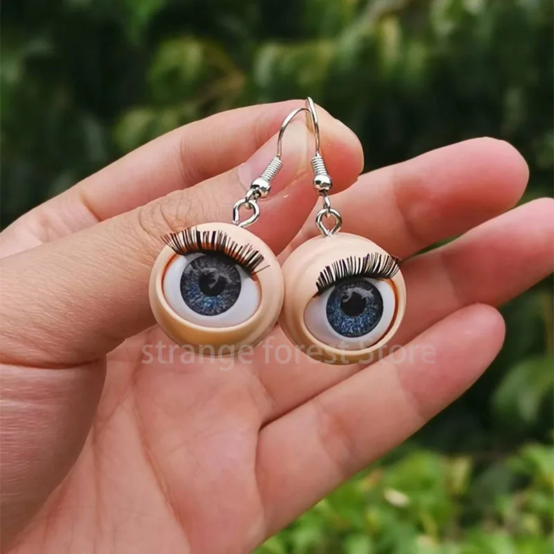 Awful creepy doll eyeball earrings with awful blinking action weirdos