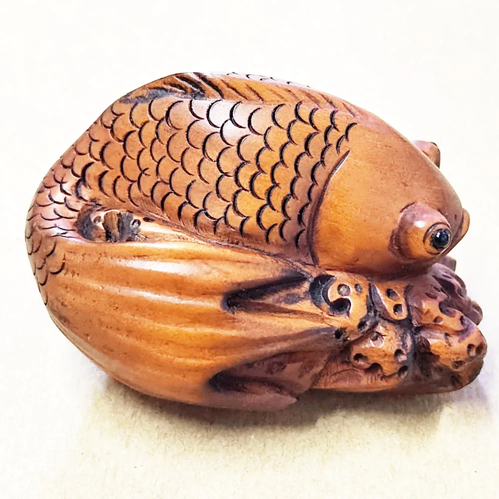 GX47-20-Years-Old-Hand-Carved-Boxwood-Netsuke-Fish-on-Coral.jpg