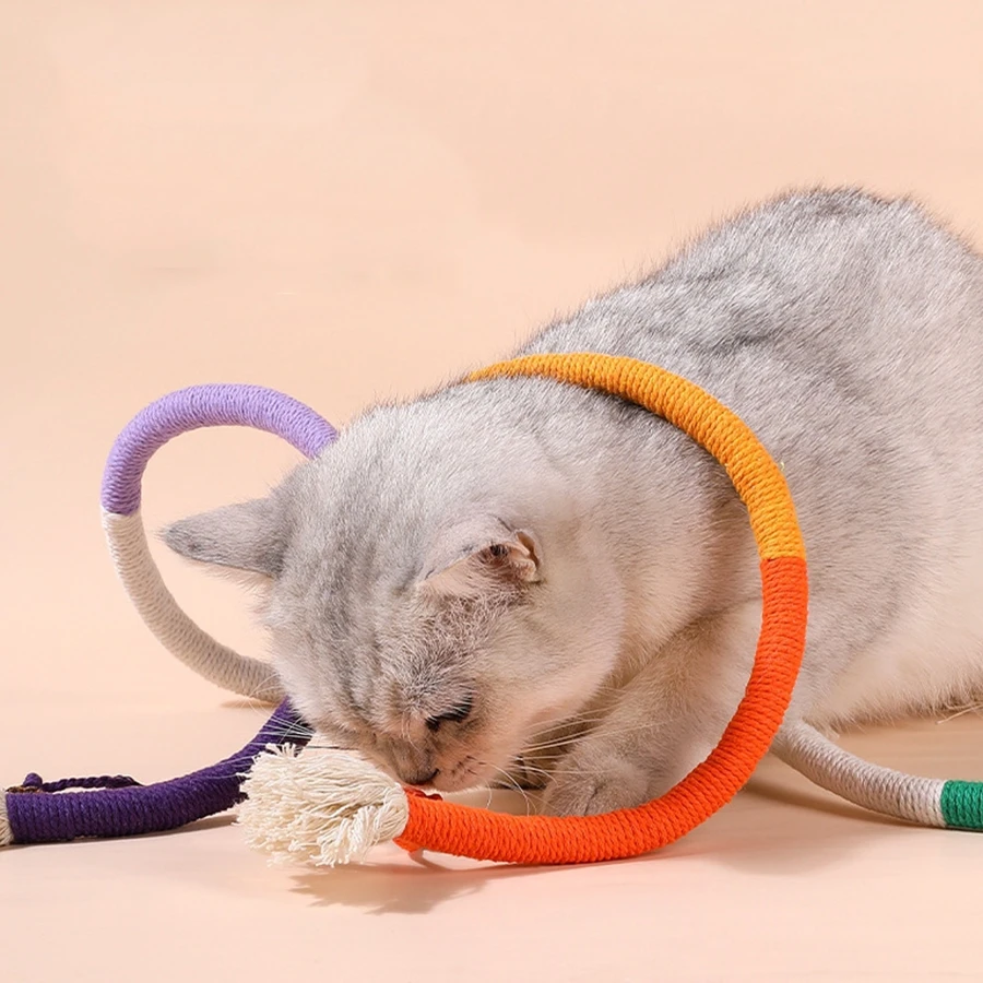 Cat-teasing-colored-cotton-rope-gnawing-stick-grinding-teeth-and ...