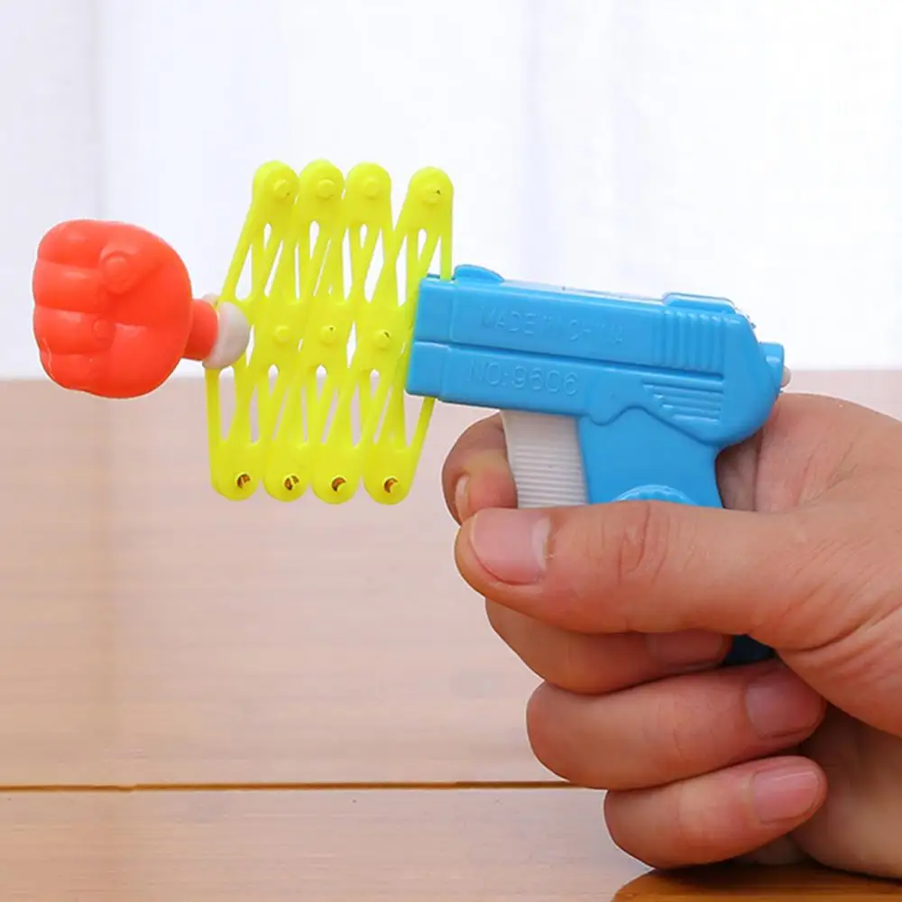 Retractable-Fist-Shooter-Trick-Toy-Gun-Funny-Child-Kids-Plastic-Party ...