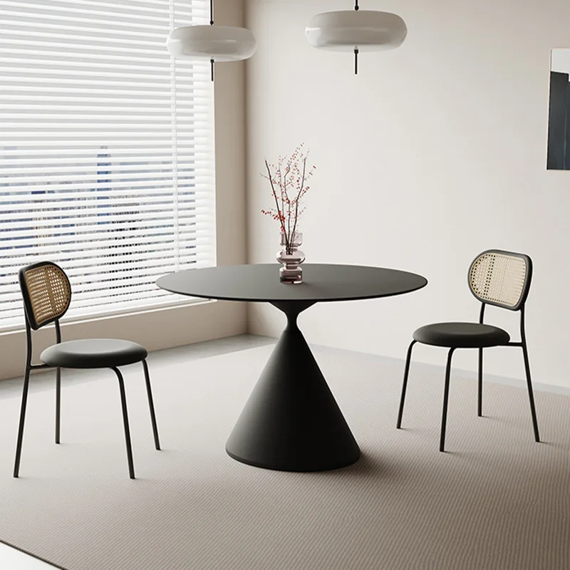 Black-rock-slab-circular-dining-table-small-red-book-modern-minimalist ...