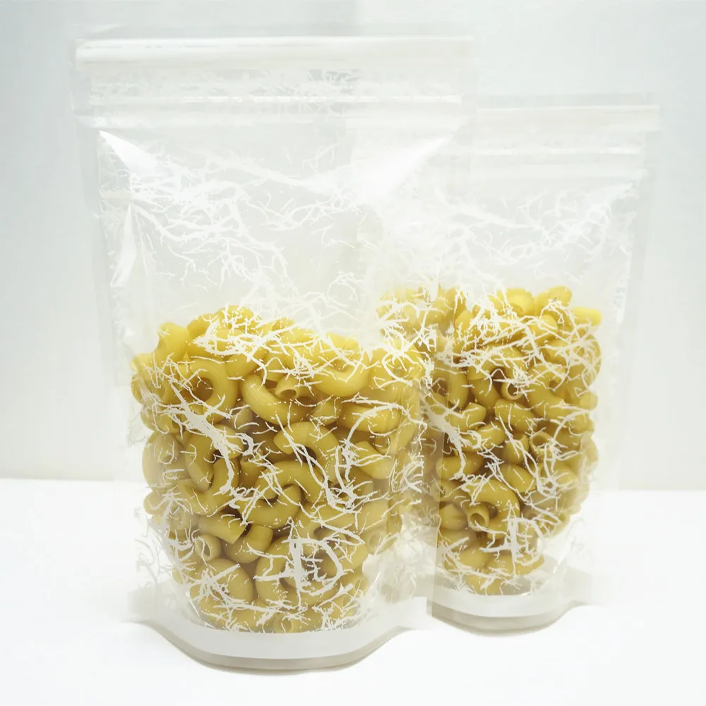 100pcs-Standing-Up-Transparent-Zip-Lock-Bags-with-White-Fancy-Printing ...