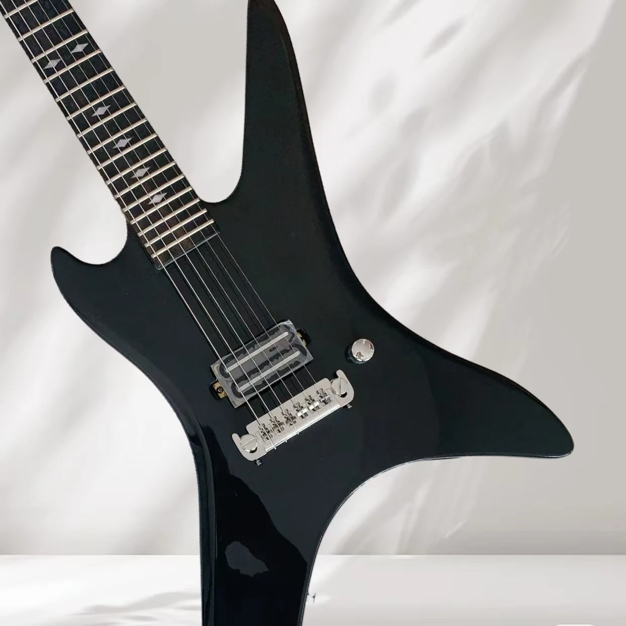 Irregular 24 Frets glossy black electric guitar, wraparound tail wing ...