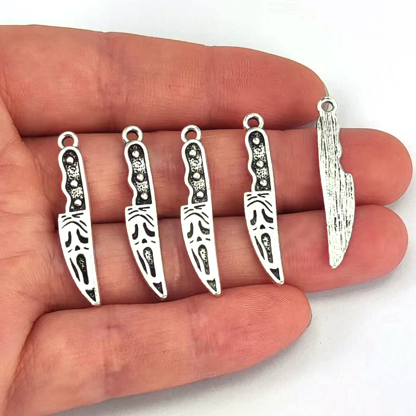 50pcs-new-Ancient-Silver-color-Knife-Skull-pendant-charm-for-DIY-women ...