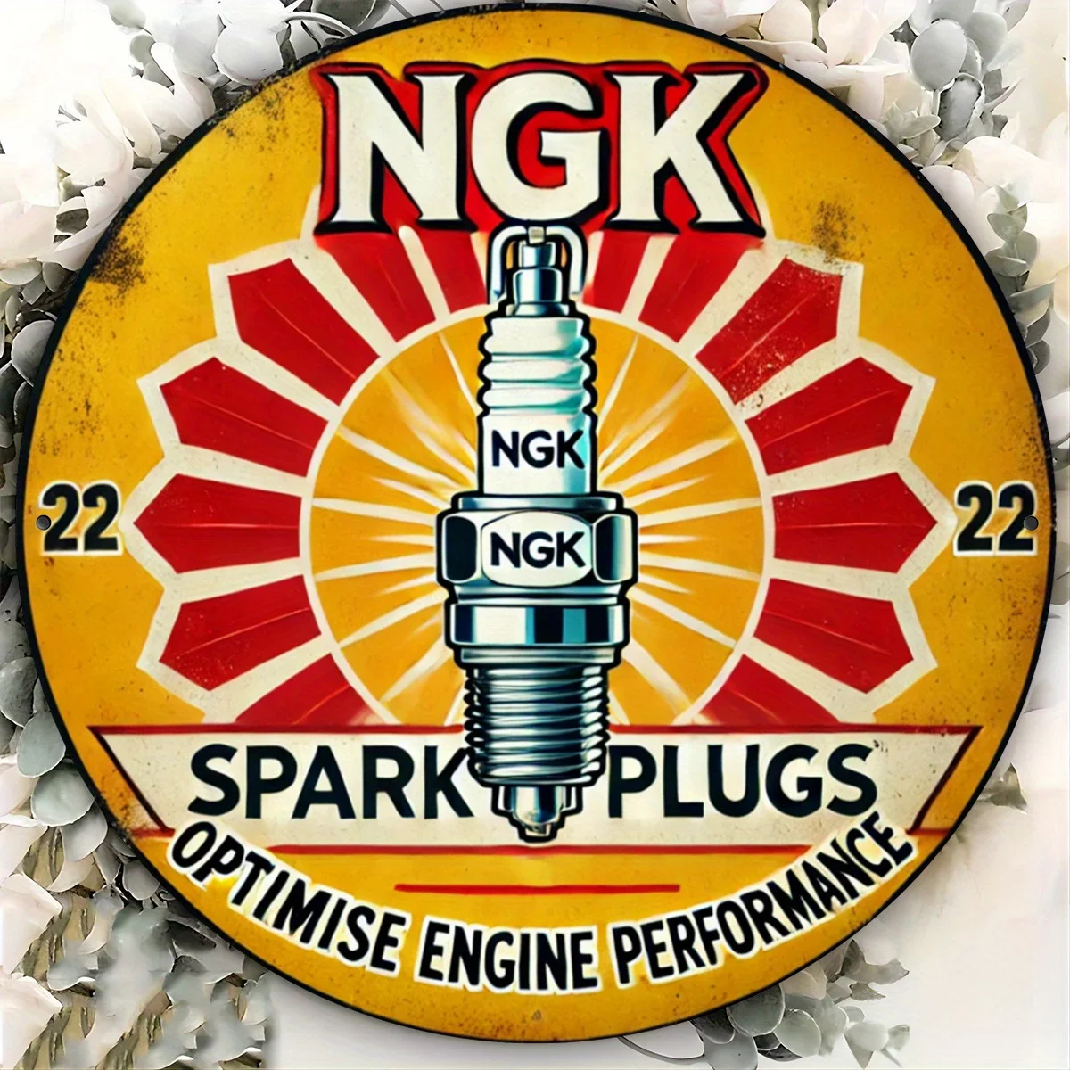 A round art decoration featuring an NGK spark plug metal sign, perfect ...