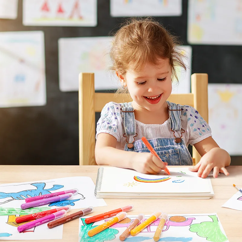 Boy Coloring With Crayons