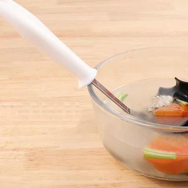 Soup Ladle Pouring Soup