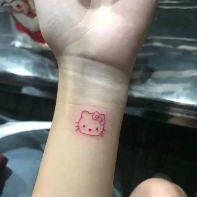 Hello Kitty Bow Tattoos On Finger