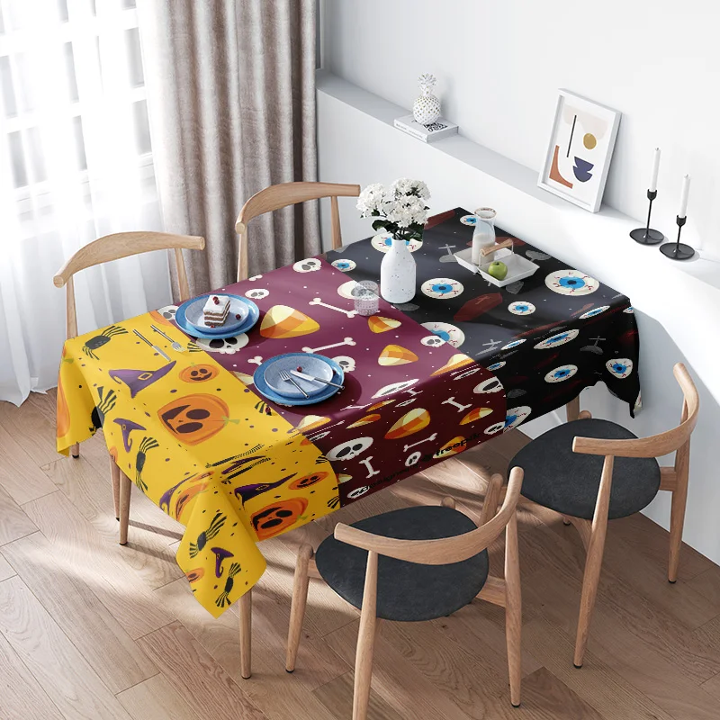 Halloween-themed tablecloth featuring a colorful design with pumpkins ...