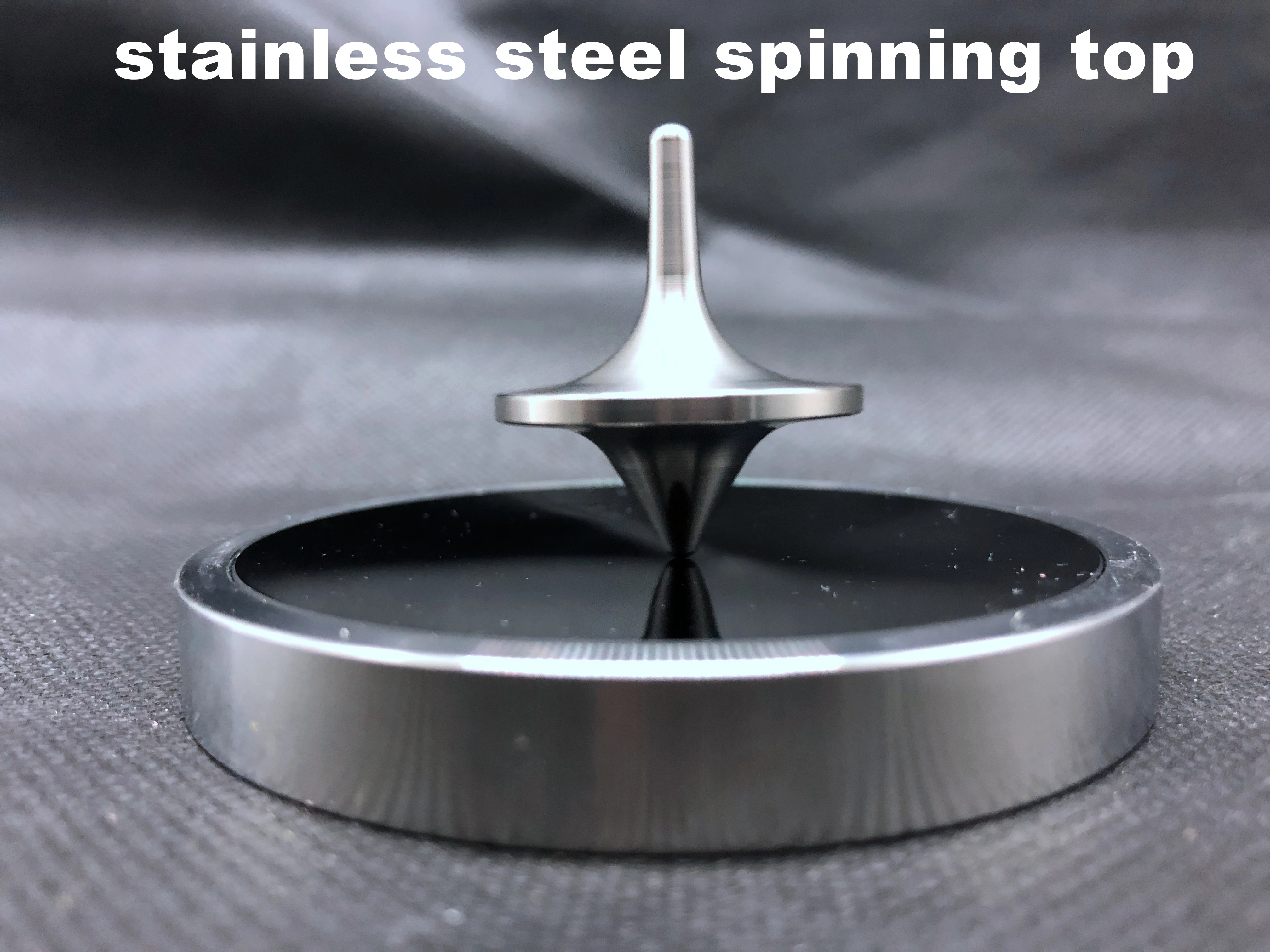 Stainless-Steel-Spinning-Top-base-black-glass.jpg