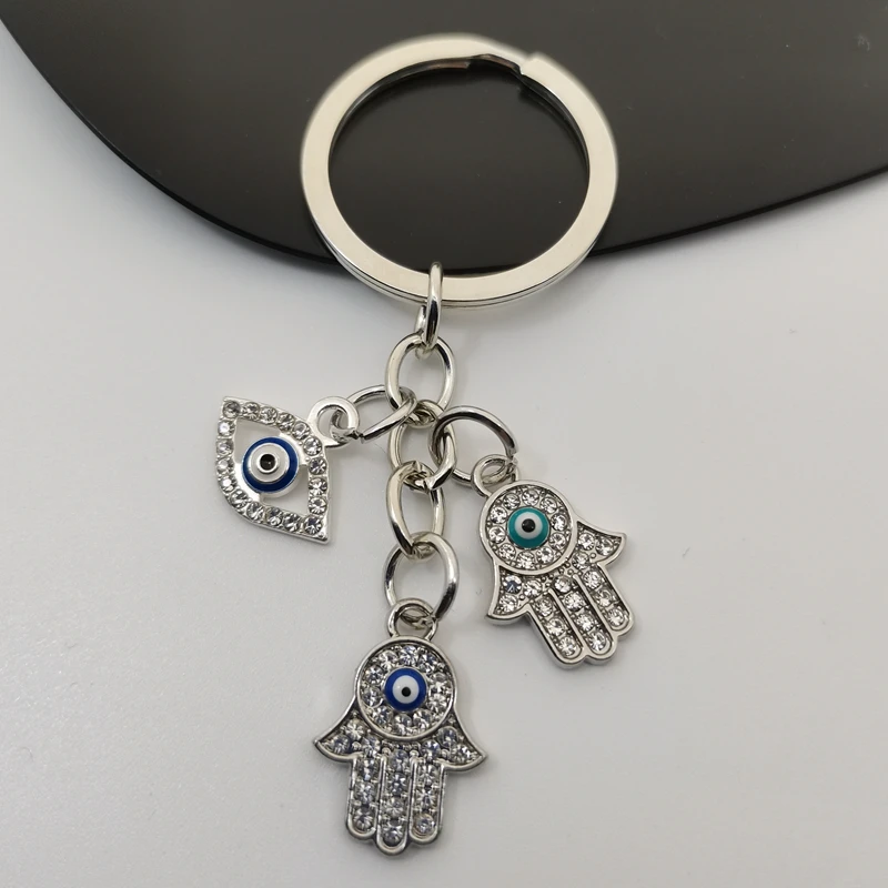 Chaveiro com pingente de mão do ham, mão de fa, buda, olho maligno ...