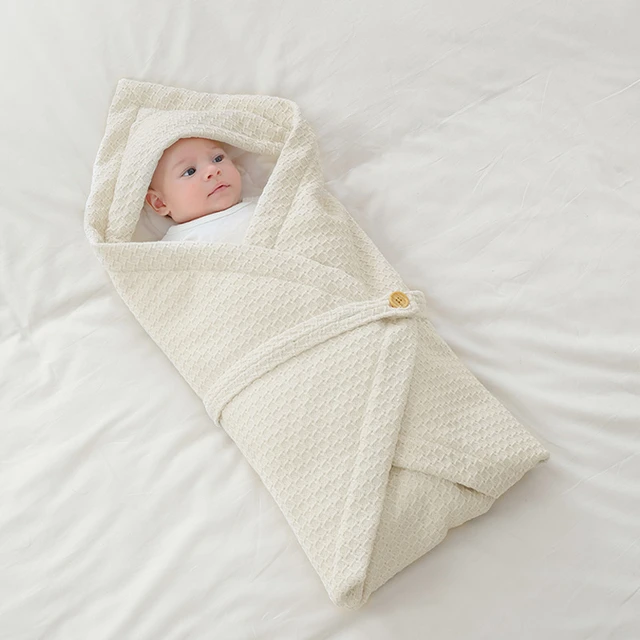 Newborn Baby Wrapped In Blanket