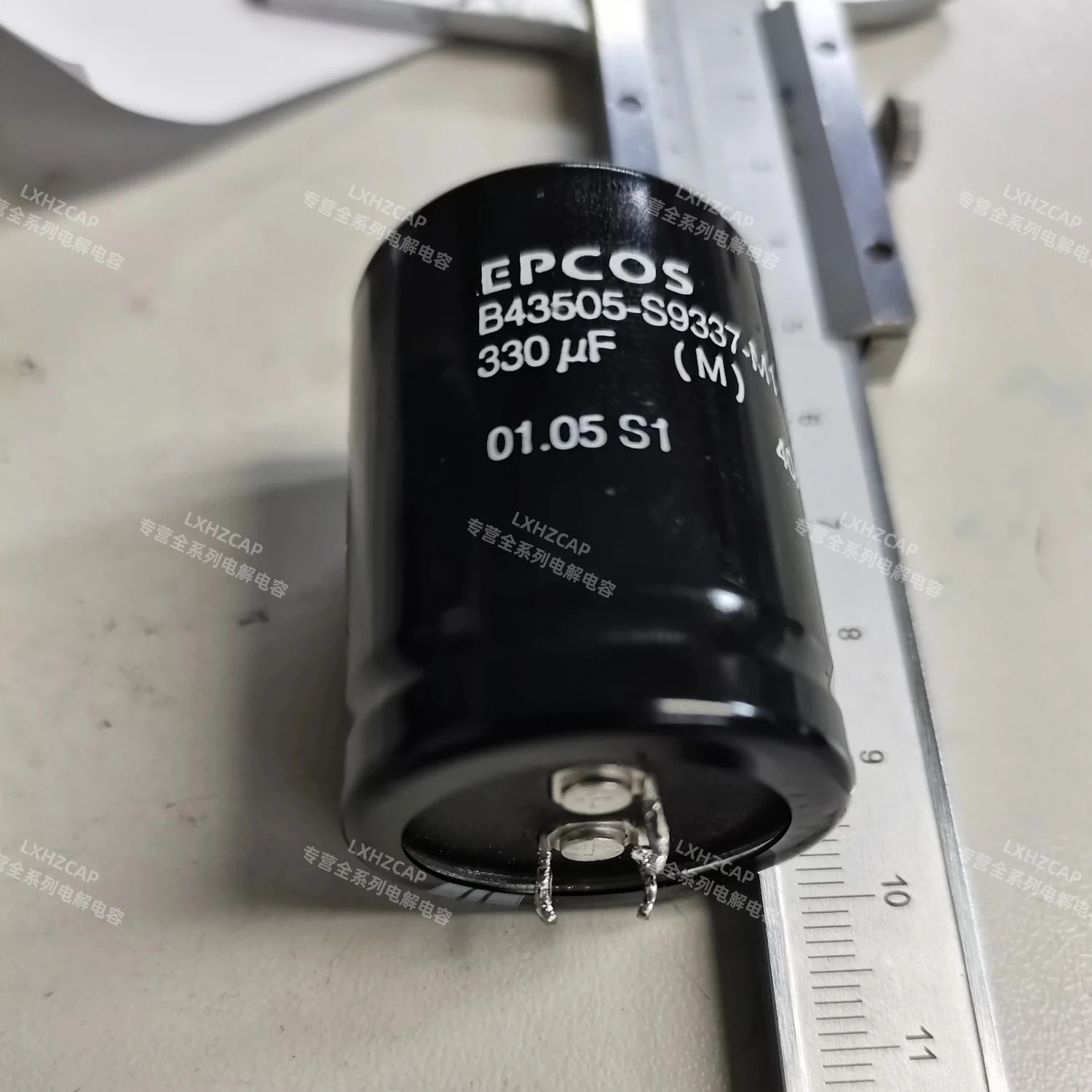 EPCOS-Capacitor-eletrol-tico-B43505-S9337-M1-400V330UF-30x40mm-3P-Novo.png