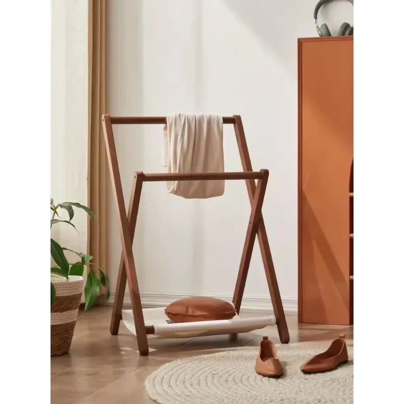 Hanging-hangers-by-the-bed-clothes-storage-artifact-rack-at-night-solid ...