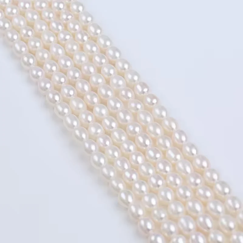 AAAA-7-8mm-White-Rice-Oval-Shape-Freshwater-Pearl-Strand.jpg