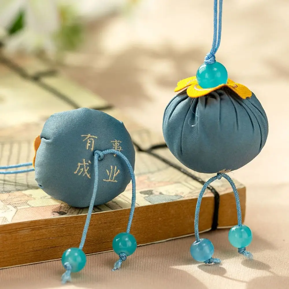 Caqui Dragão: Saco Perfumado com Bordados Herbais para o Festival