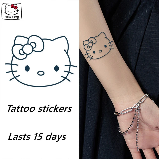 Hello Kitty Bow Tattoo On Finger