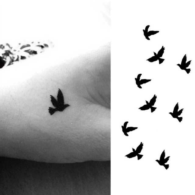 Black Bird Flying Tattoo