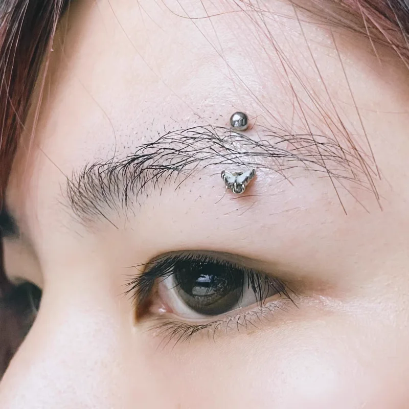 Vertical Eyebrow Piercing