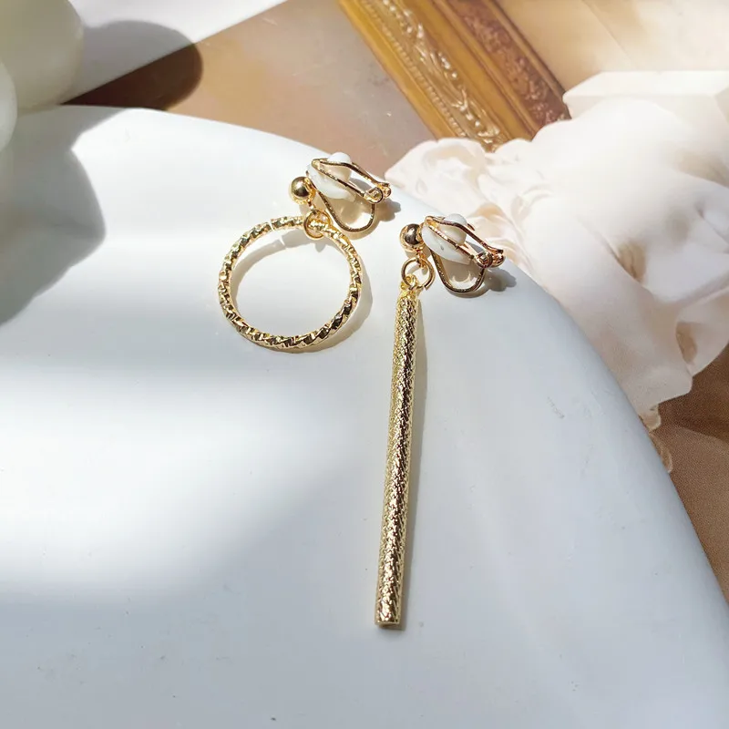 Fashionable Metallic Gold Color Asymmetrical Circle Line Clip-On Ear ...