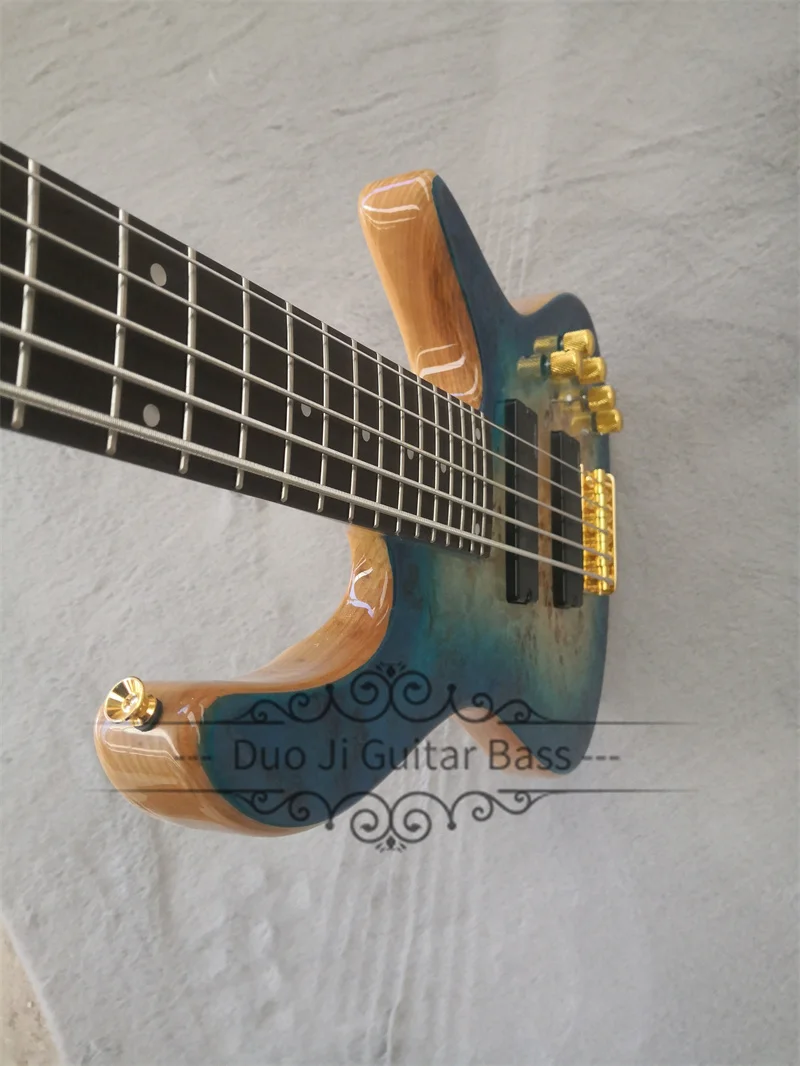 Classic 5 string bass, blue electric bass, maple neck through the white ...