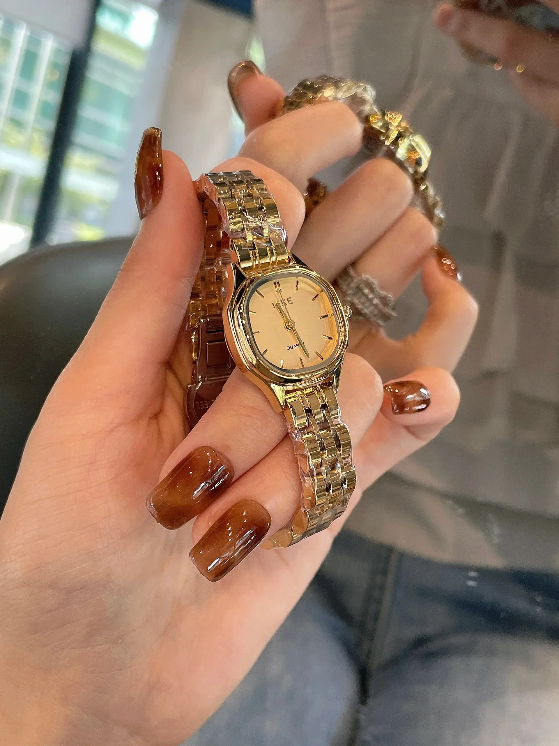Women Wearing Gold Watches