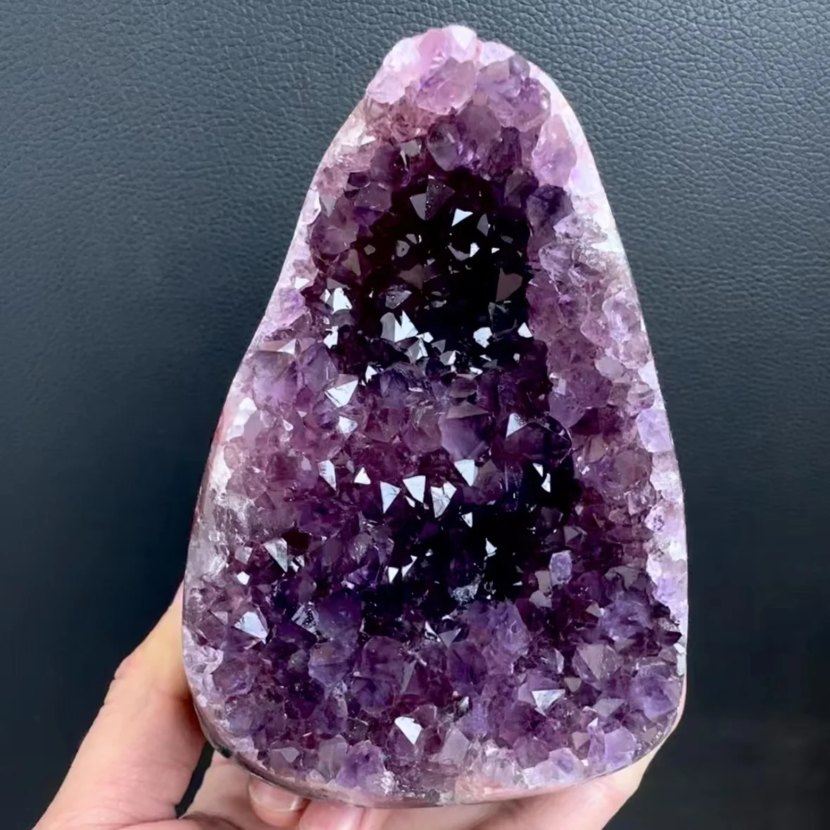 Natural raw amethyst surrounded by a powerful energy magnetic field of ...